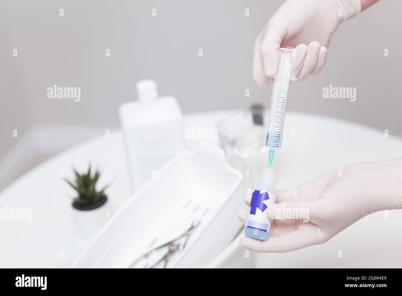 Unrecognizable manicurist preparing disinfectant solution to clean ...