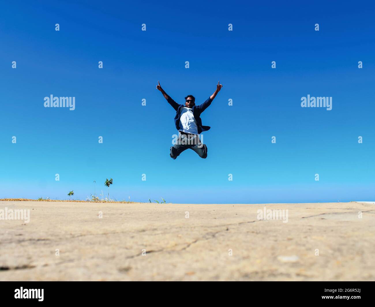 Concept of success and achievement.. Man jump on sky. Jumping man with ...