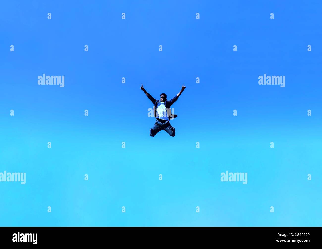 Concept of success and achievement.. Man jump on sky. Jumping man with ...