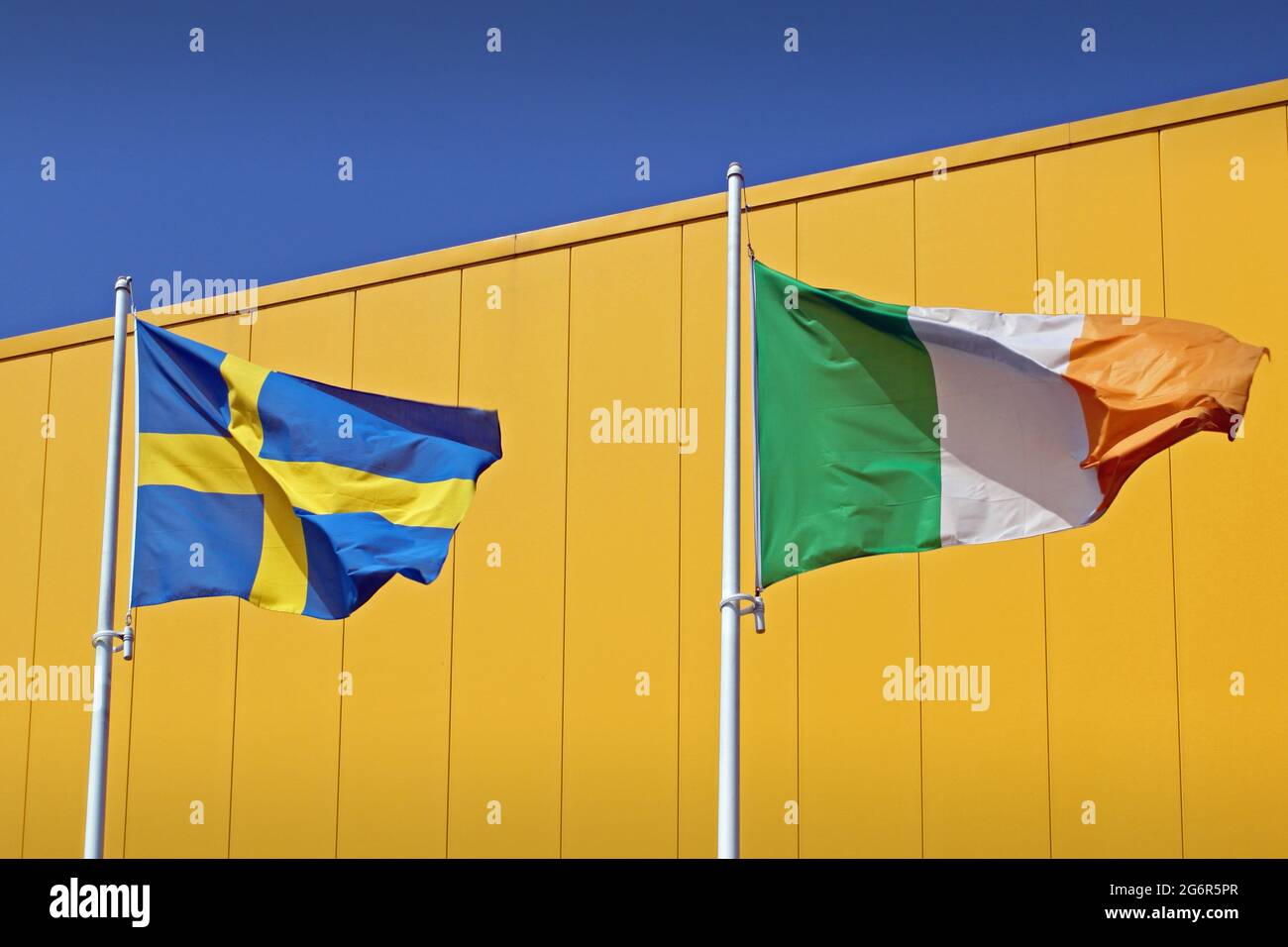 Irish and Swedish flags against a blue and yellow background Stock ...