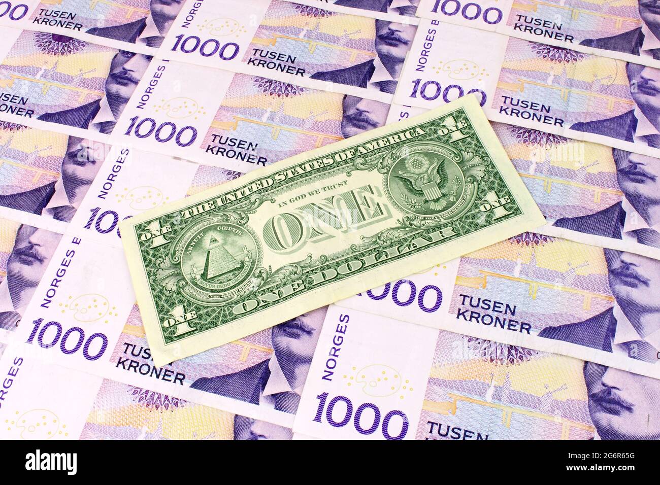 Norwegian currency notes in a grid pattern, with a one US Dollar note ...