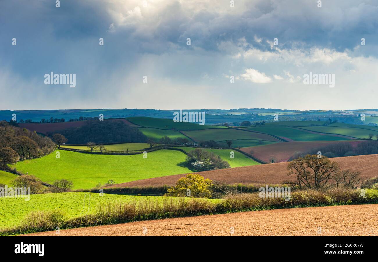 Dramatic clouds and sky over fields of Berry Pomeroy, Devon, England ...