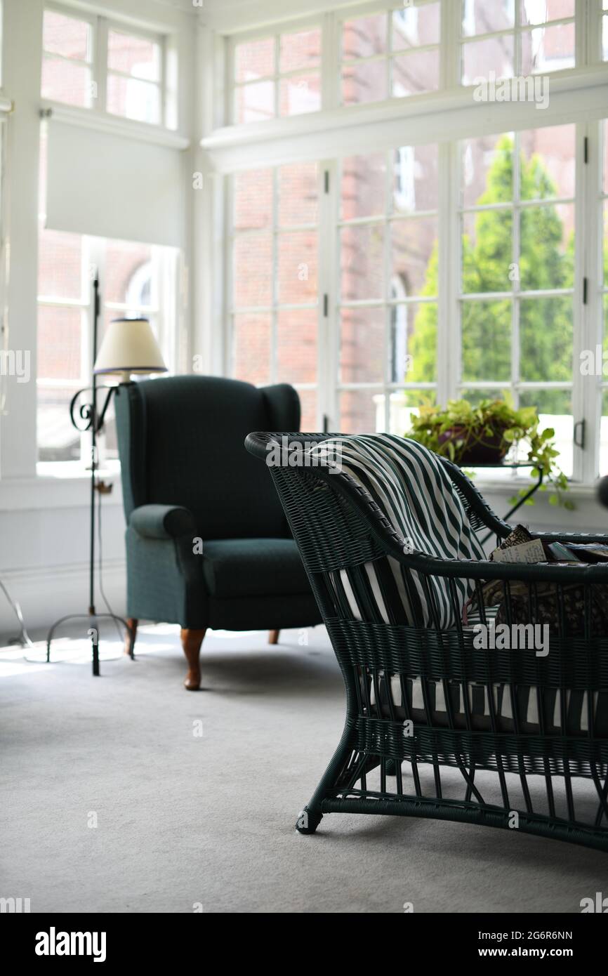 Gorgeous classic sunroom interior with sofa armchairs Stock Photo - Alamy