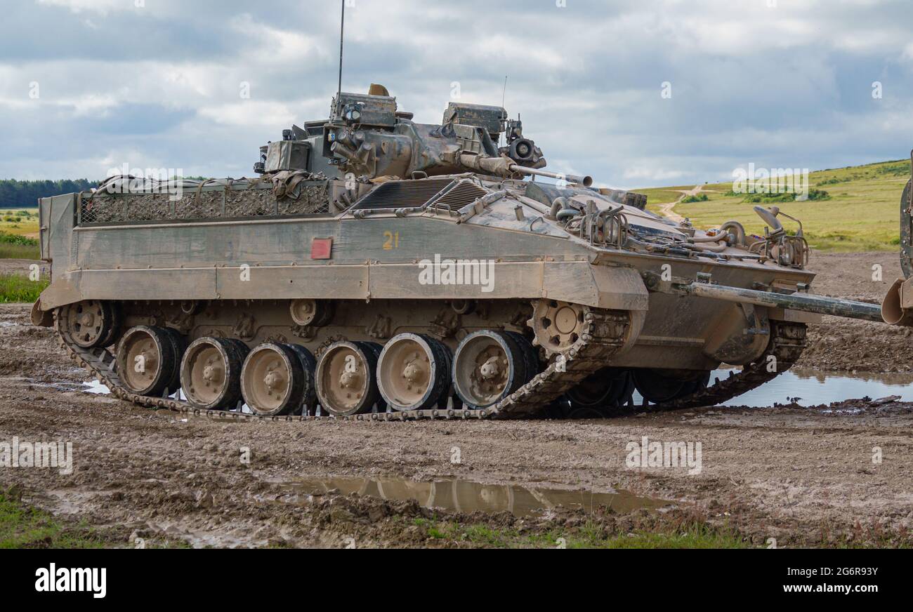 british army FV510 Warrior vehicle being towed by a Warrior FV512 on ...