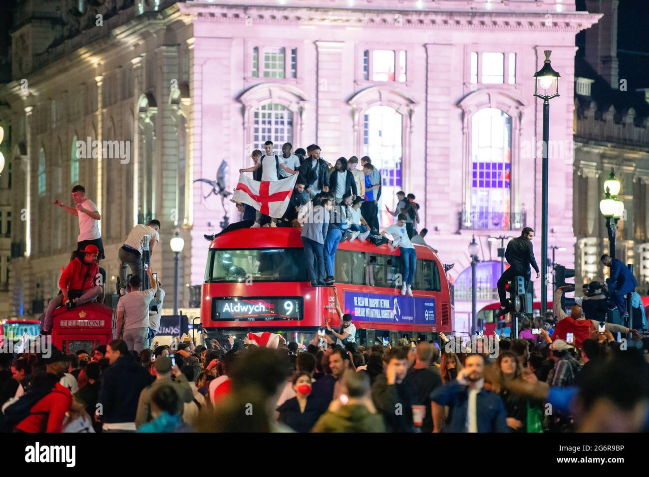 Football fans in Piccadilly in Londonís west end climb on top of a ...