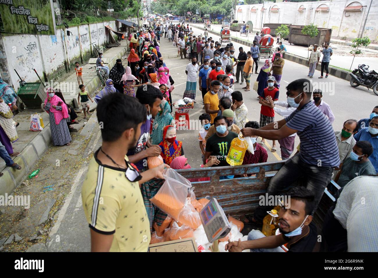 July 9, 2021: Dhaka,Bangladesh: Thousands of people are standing in ...