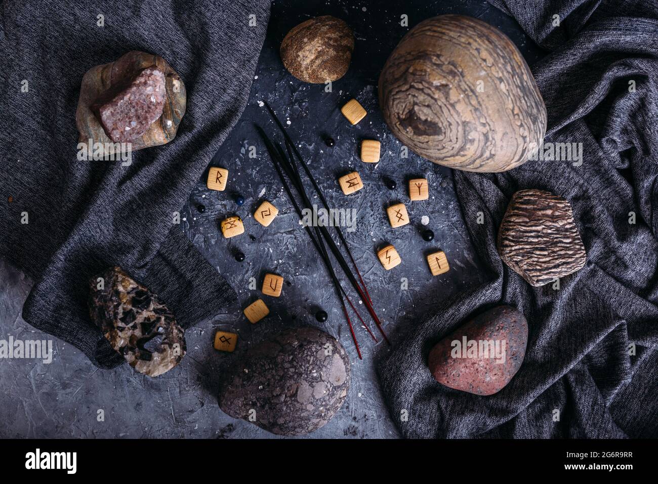 Incense sticks among the gloomy and esoteric paraphernalia - runes ...