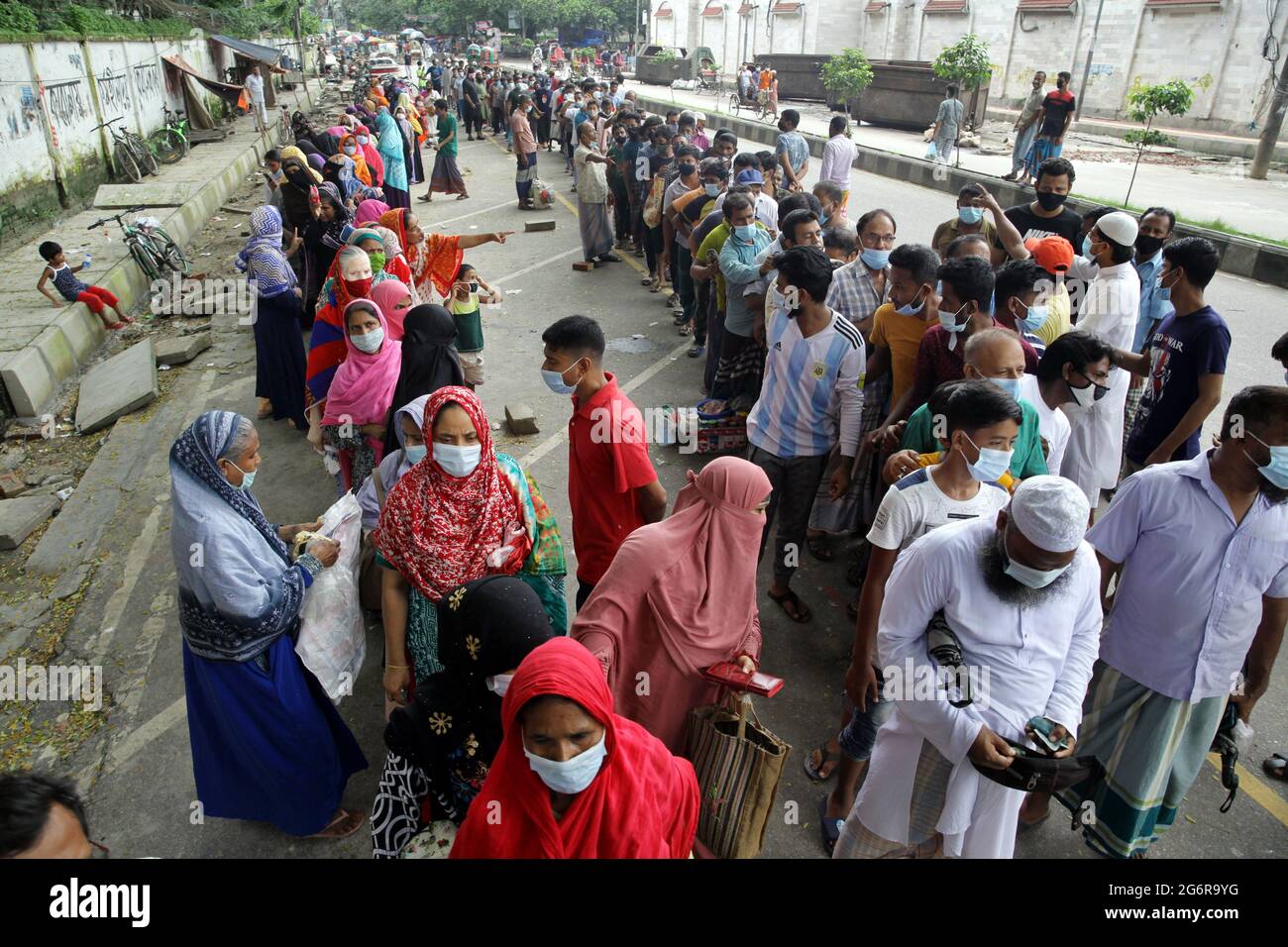 July 9, 2021: Dhaka,Bangladesh: Thousands of people are standing in ...