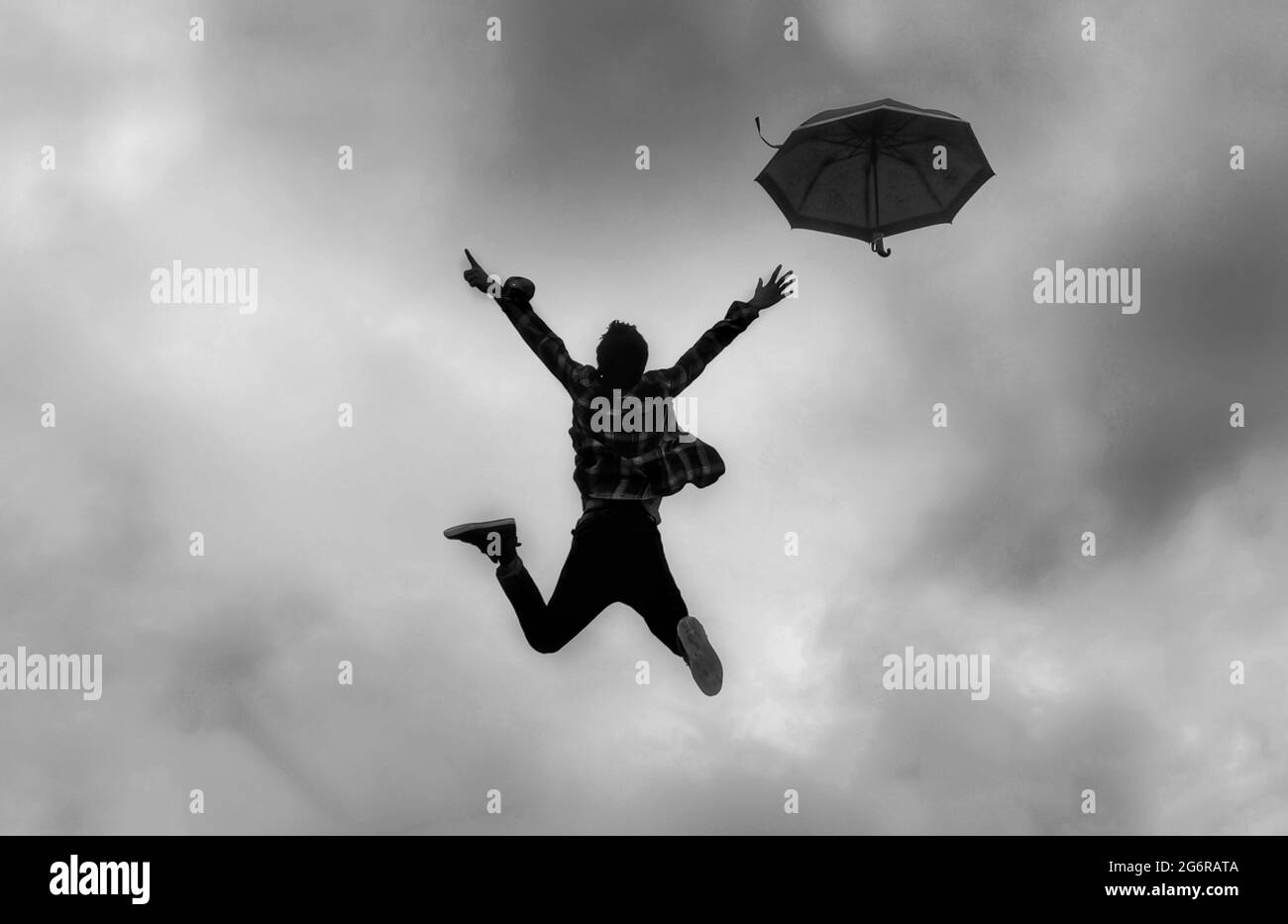 Man jumping on sky with umbrella. Jumping man on sky with cloudy ...