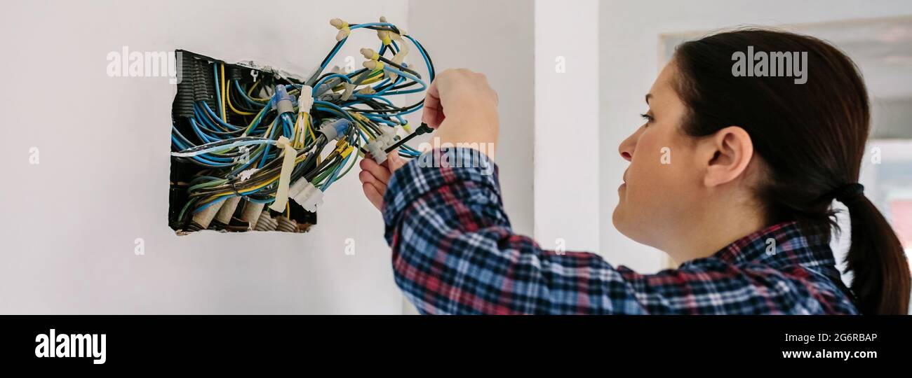 Electrician working on the electrical installation of a house Stock ...