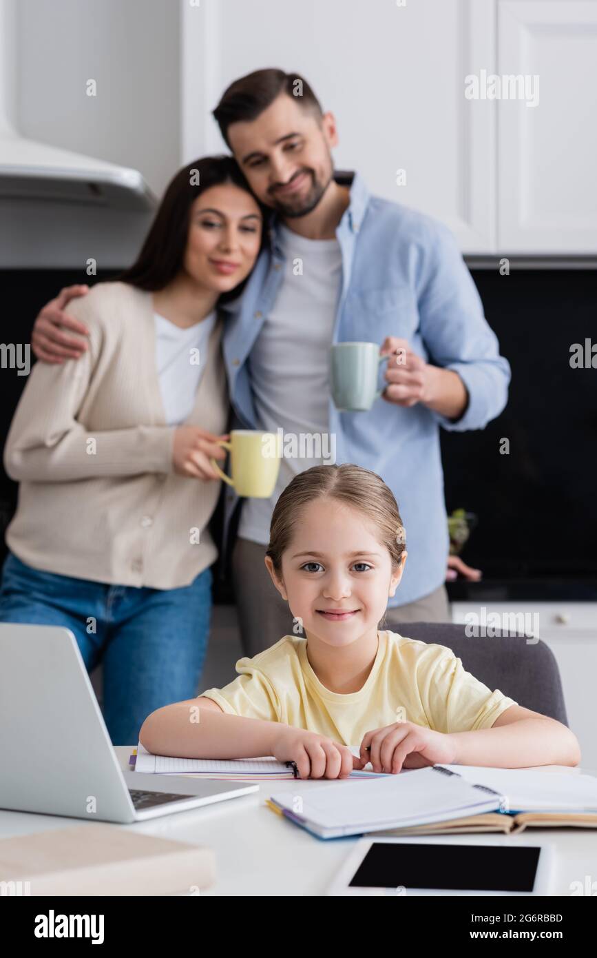 Parents look at laptop screen hi-res stock photography and images - Alamy