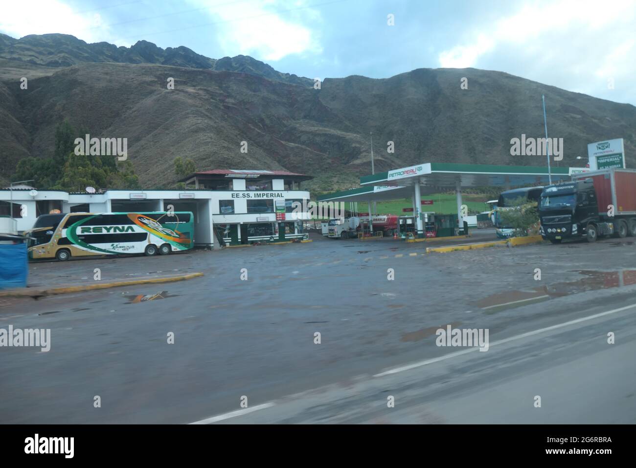 Petrol station and bus Republic of Peru hill hills mountain mountains ...