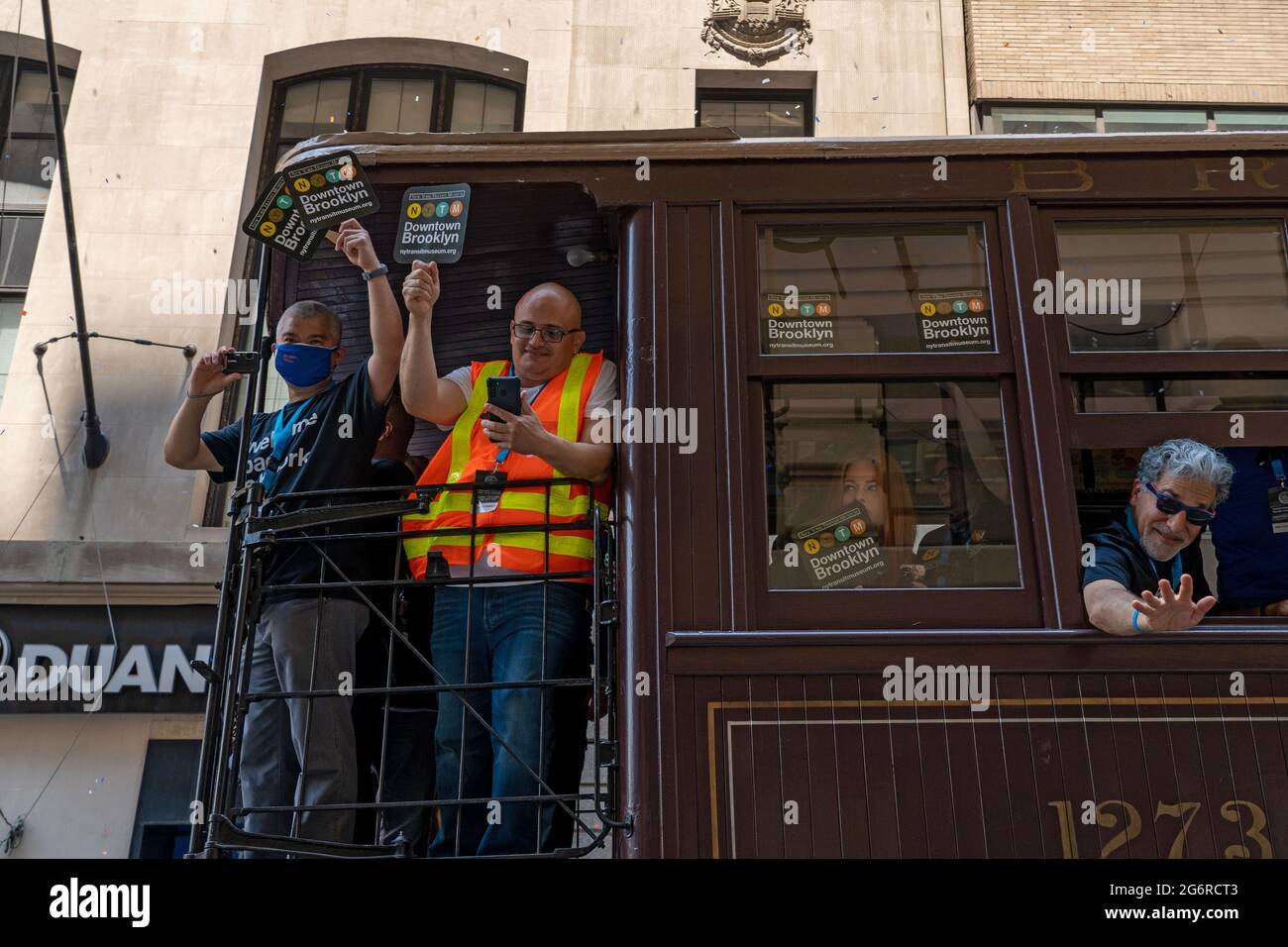MTA workers ride a 118-year-old subway car during the "Hometown Heroes ...