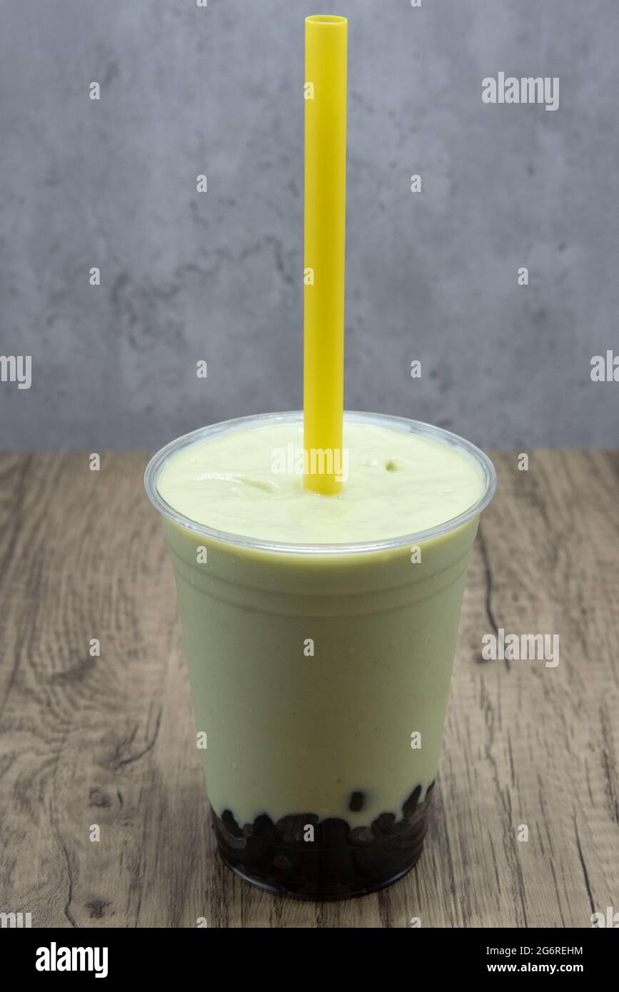 Avocado flavored smoothie with sweet tapioca boba balls at the bottom ...