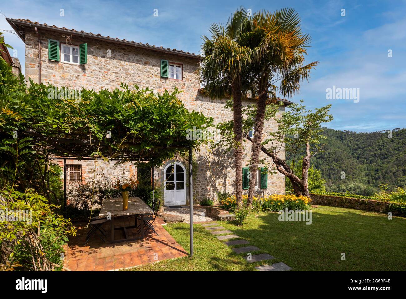 Typical Italian farmhouse of Tuscany. Exterior with large garden stone ...