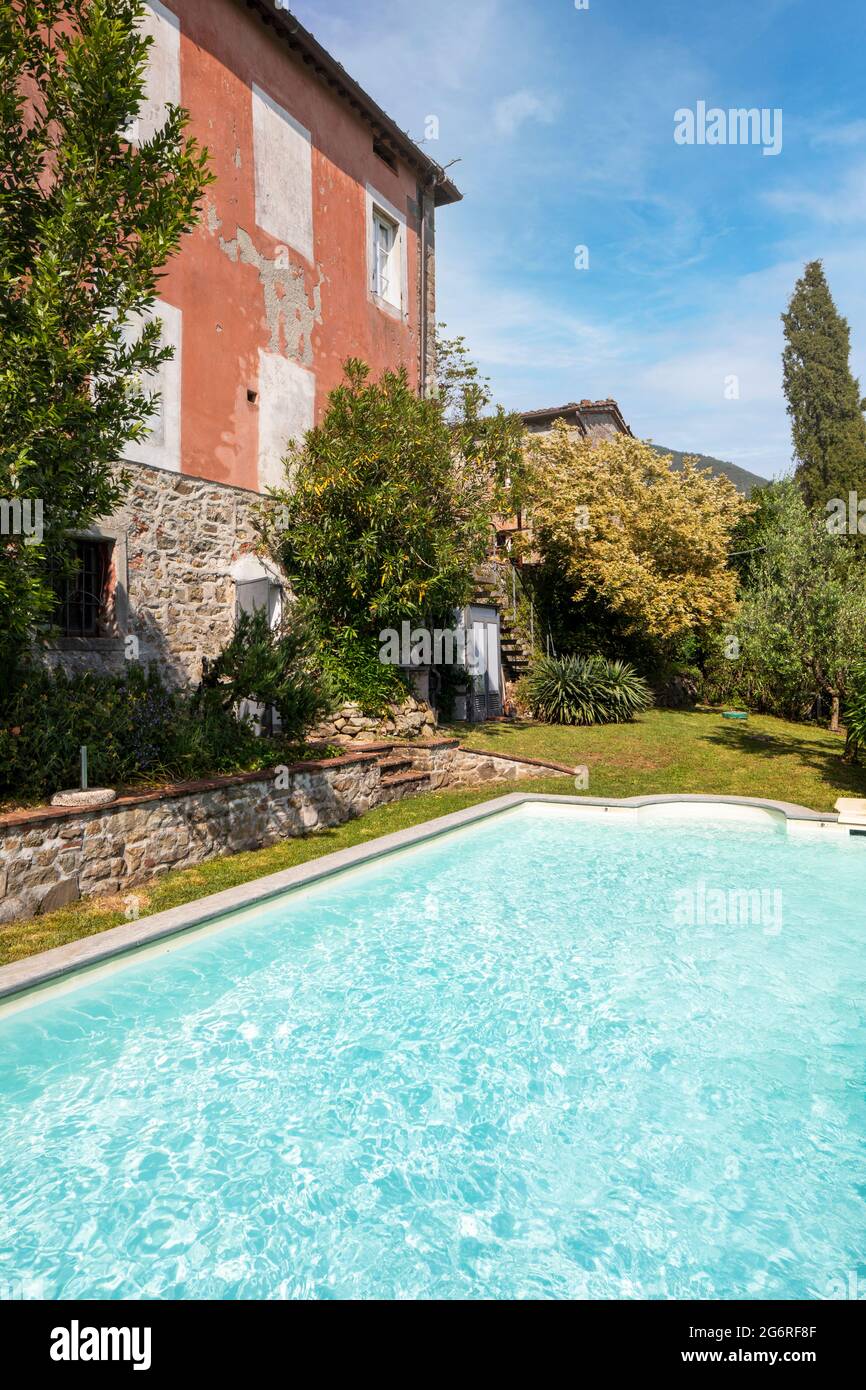 Exterior of Italian villa in Tuscany with swimming pool. Day of great ...
