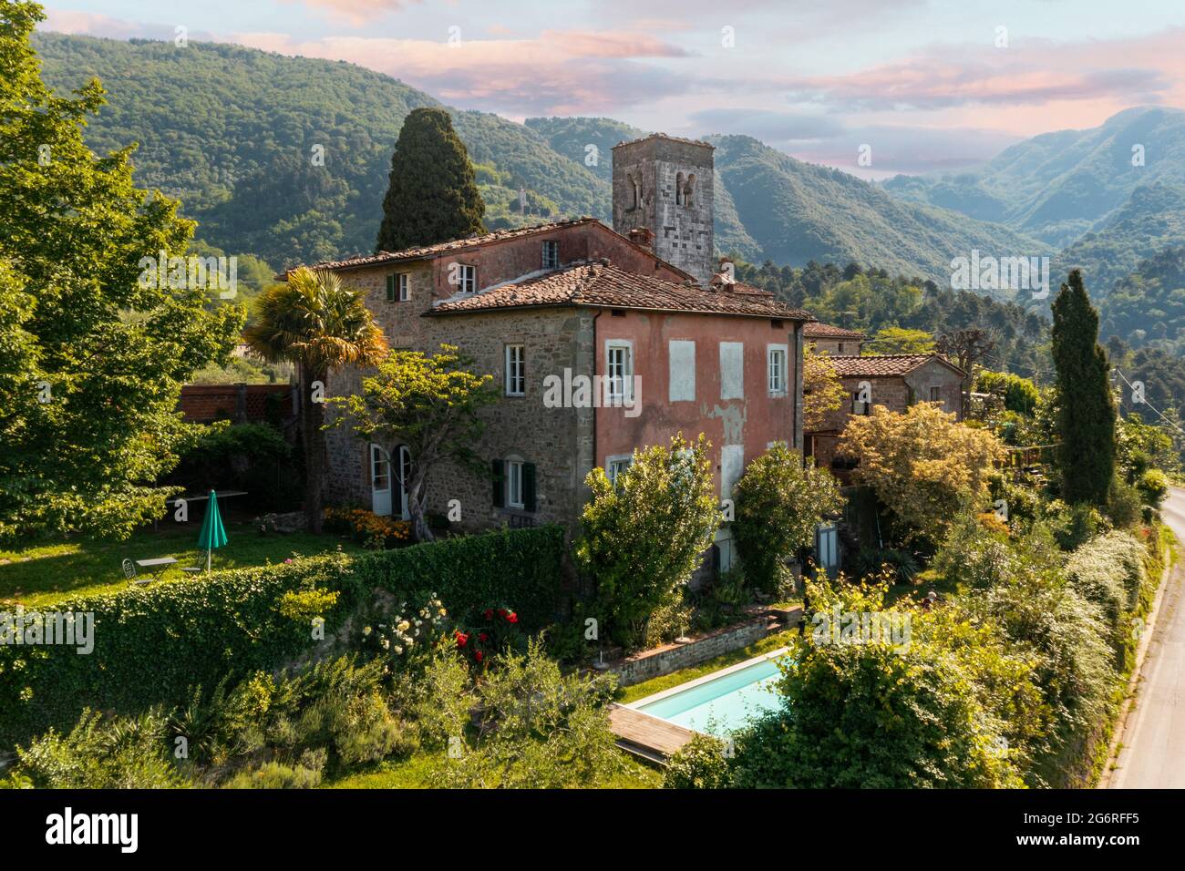 House or cottage in the middle of summer with a beautiful garden and ...