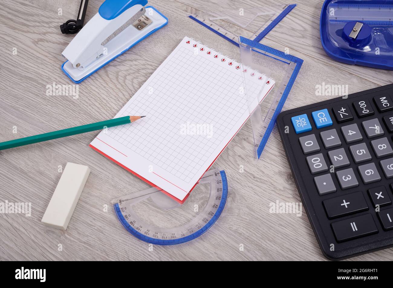 Blank Notebook Page With A Calculator And Geometric Stationery Sets On ...