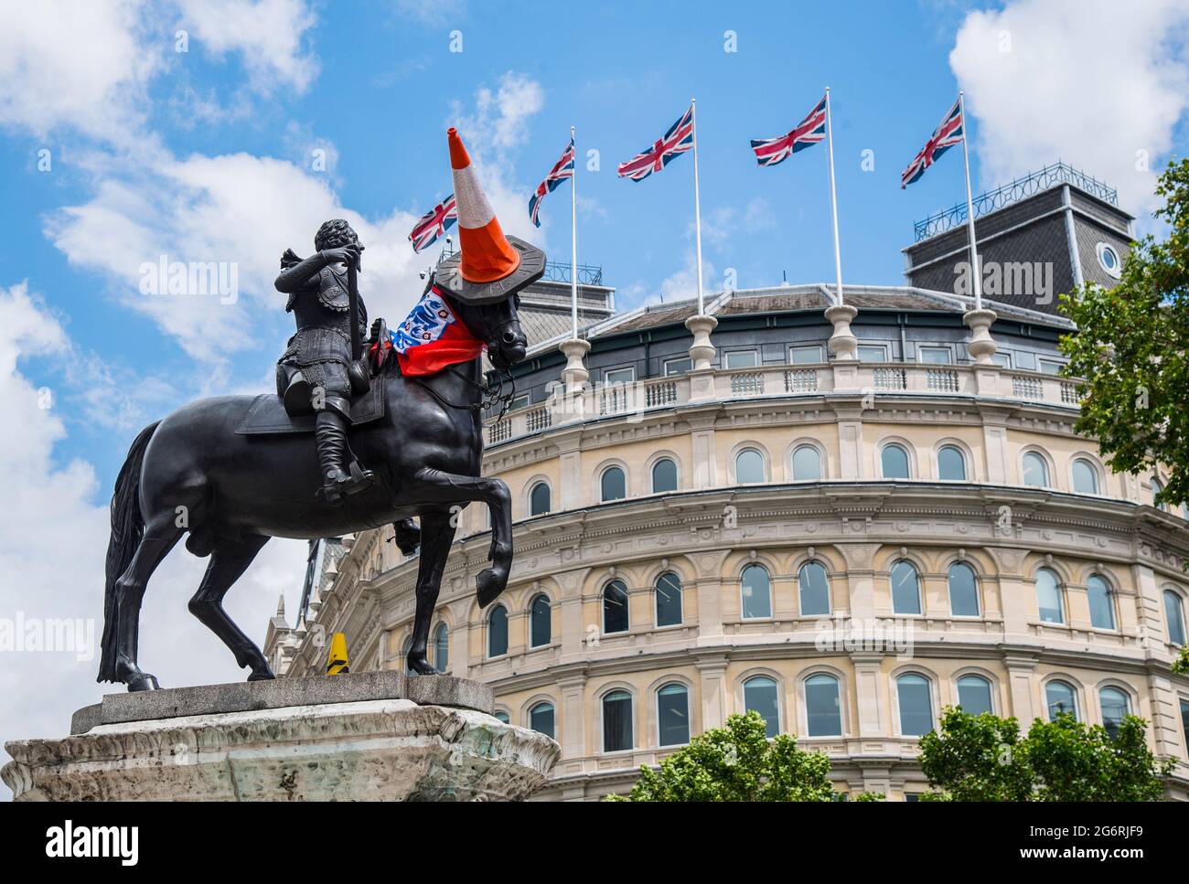 An England flag and a cone on the statue of Charles I near Trafalgar ...