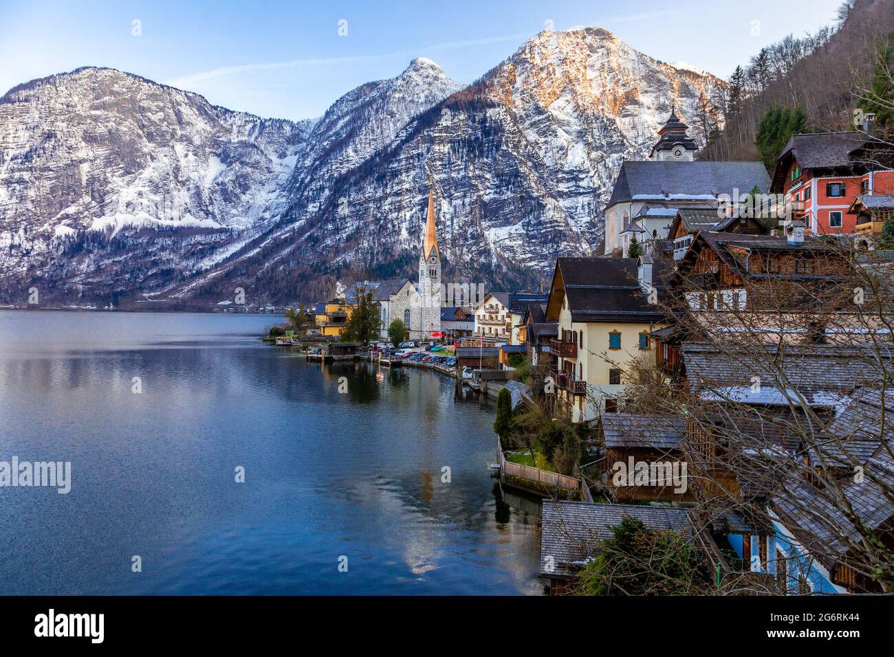 View of the famous Hallstatt town at the lake with mountain ranges in ...