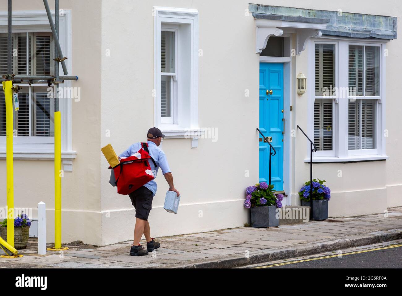 Postman delivering mail hi-res stock photography and images - Alamy