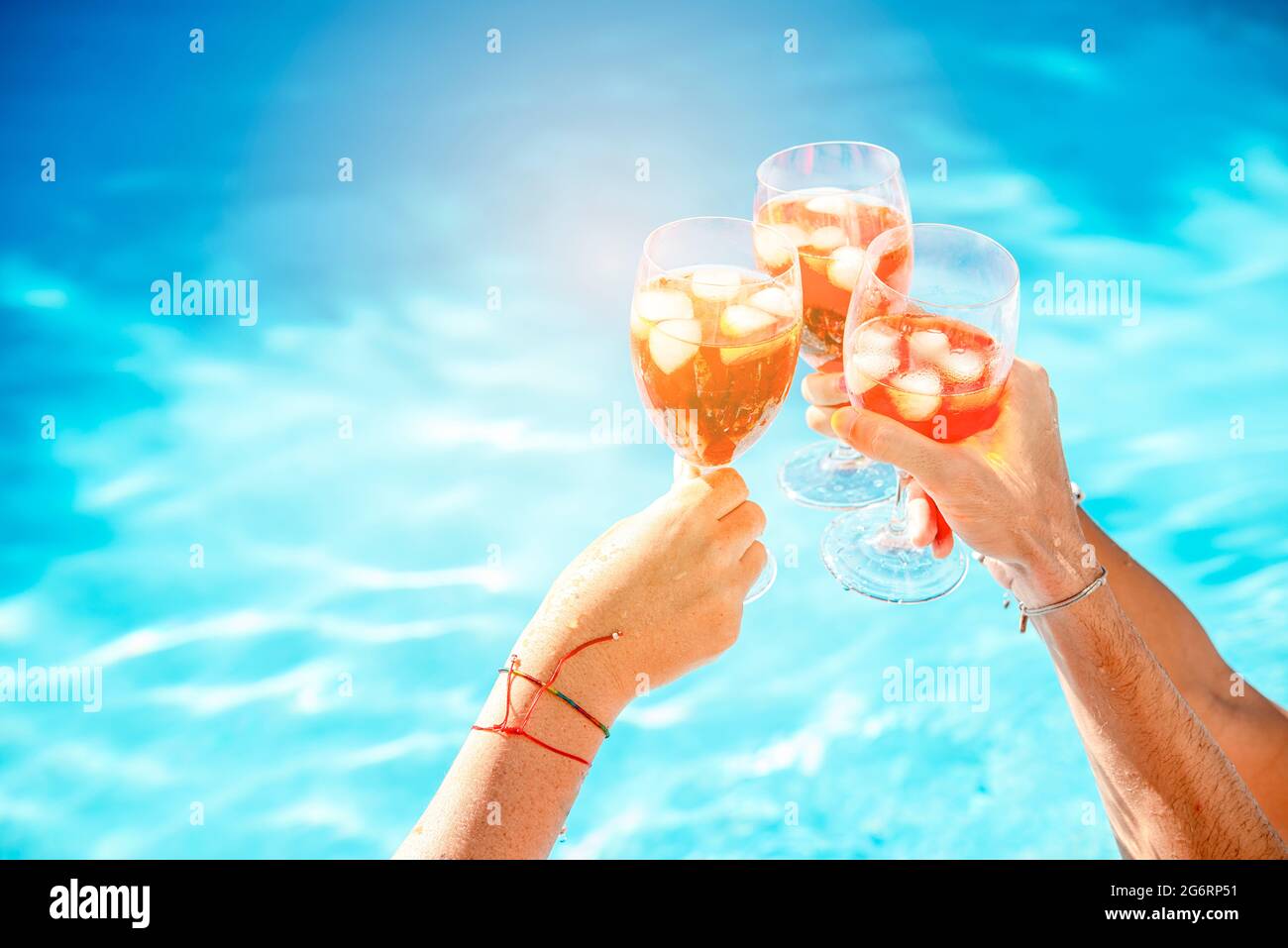 trio traveler hands holding glass of cocktails on outdoor luxury ...