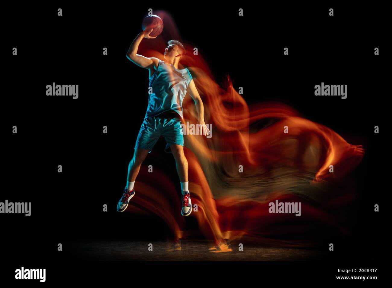 Young caucasian man, male basketball player playing basketball isolated ...