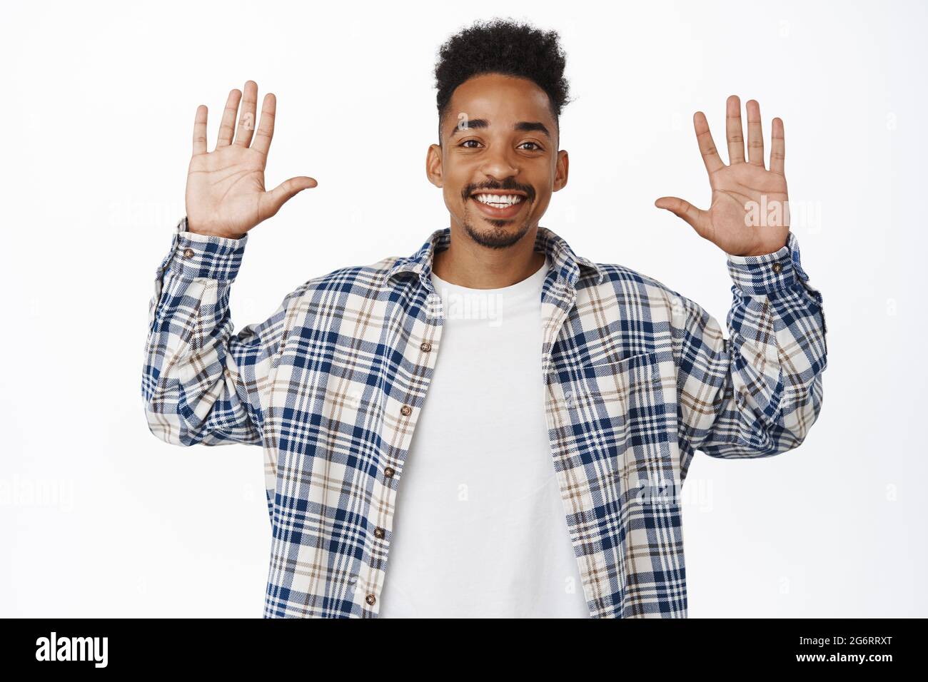 Image of handsome friendly-looking young man saying bye. African ...