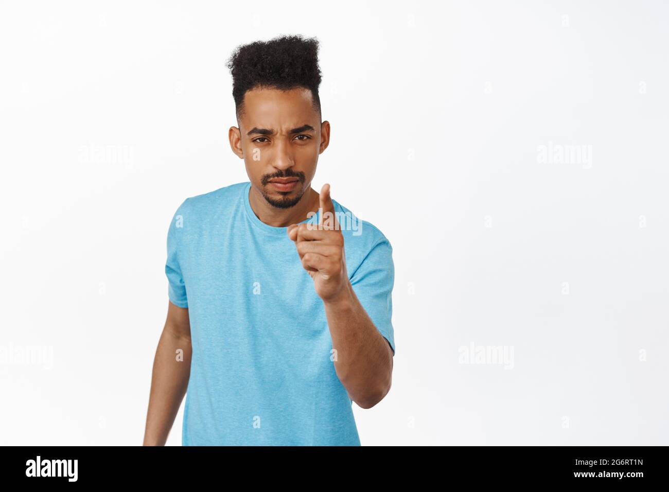 Very bad behaviour. Disappointed african american young man scolding ...