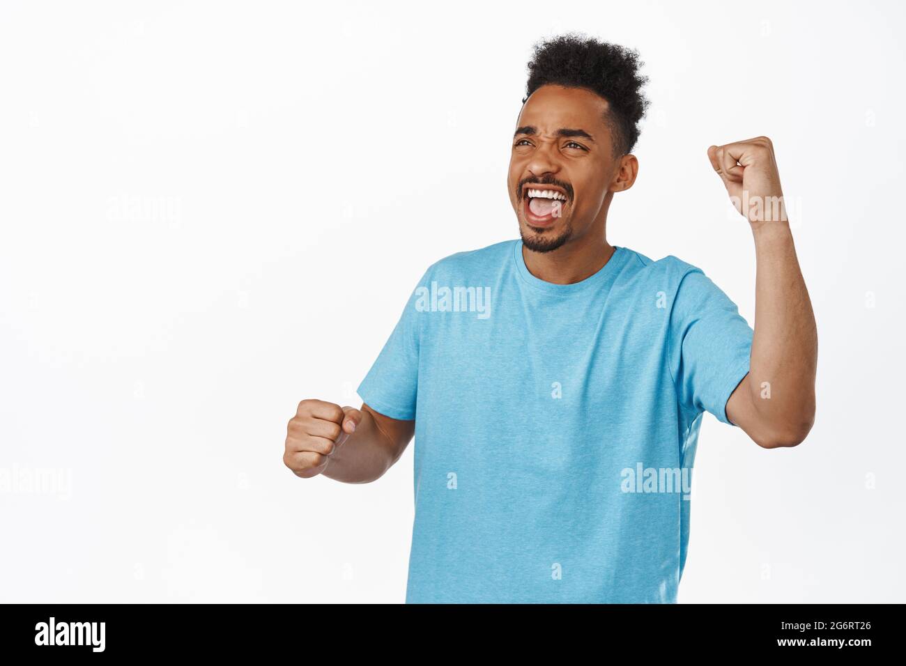 Image of cheerful african american man chanting, rooting for sport team ...
