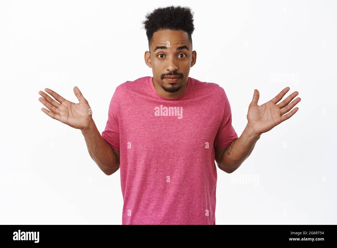 Nothing to say. Clueless african american guy raising empty hands up ...