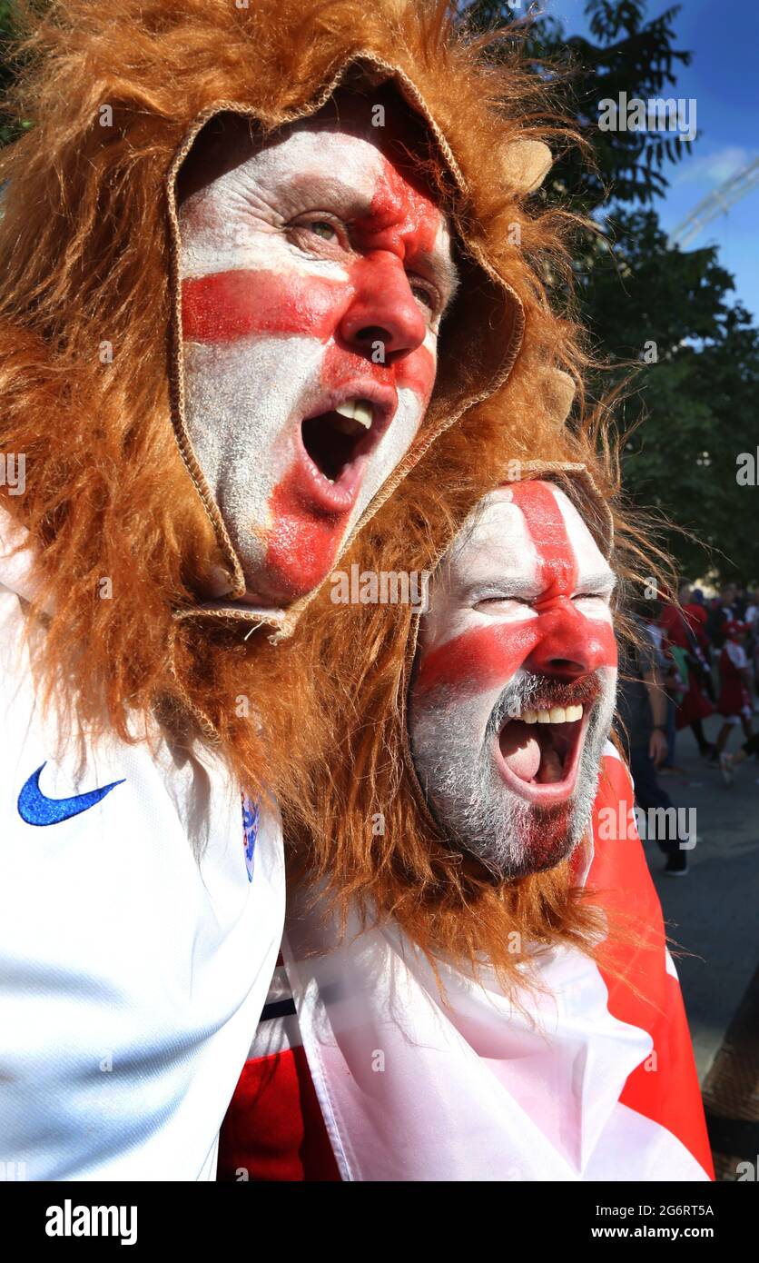 London, UK. 07th July, 2021. Fan's faces painted with England flag as ...