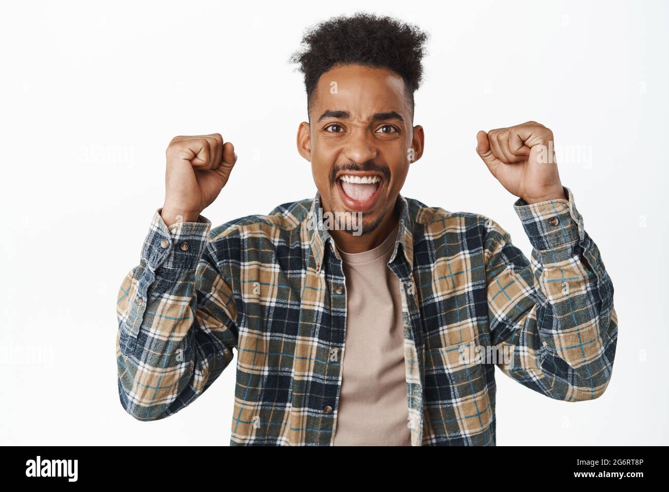 Young cheerful african american man scream in support, shouting like ...