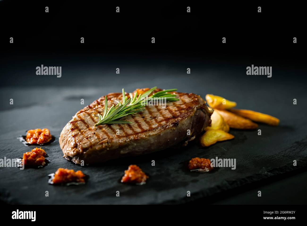 beef steak on a dark background Stock Photo - Alamy