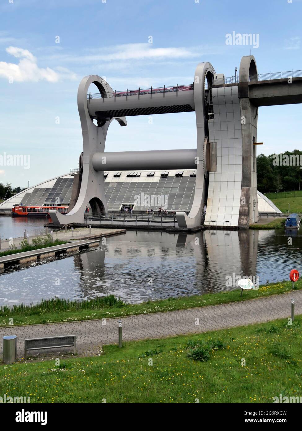 the Falkirk Wheel , rotating boat lift connects the Forth and Clyde ...