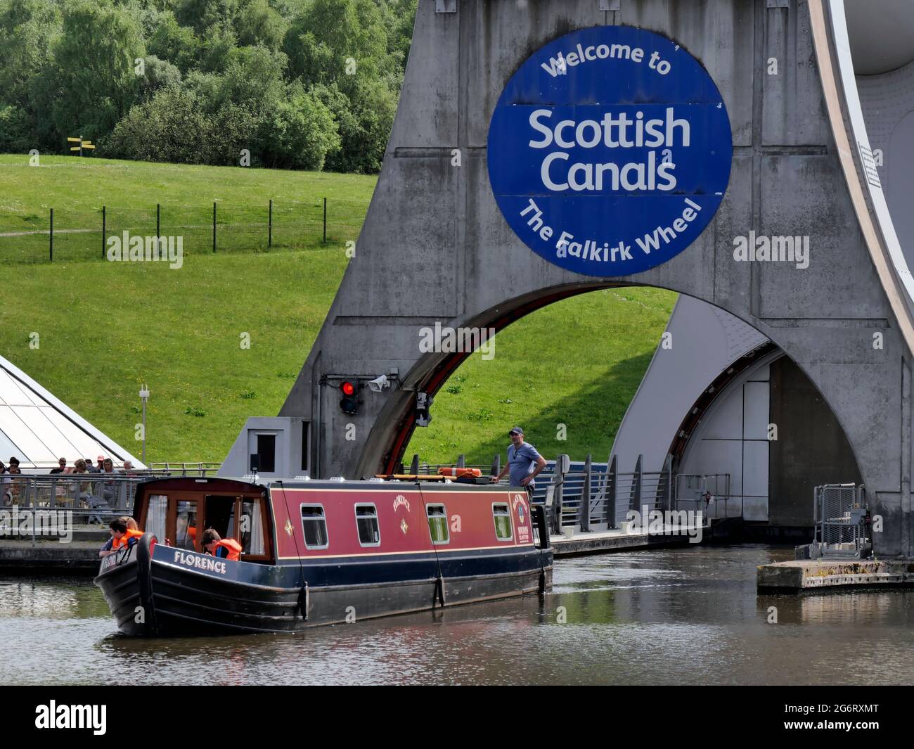 a narrow boat exits the Falkirk Wheel a rotating boat lift connects the ...