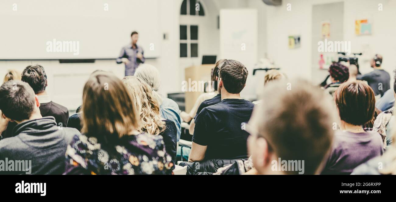 Man giving presentation in lecture hall at university Stock Photo - Alamy