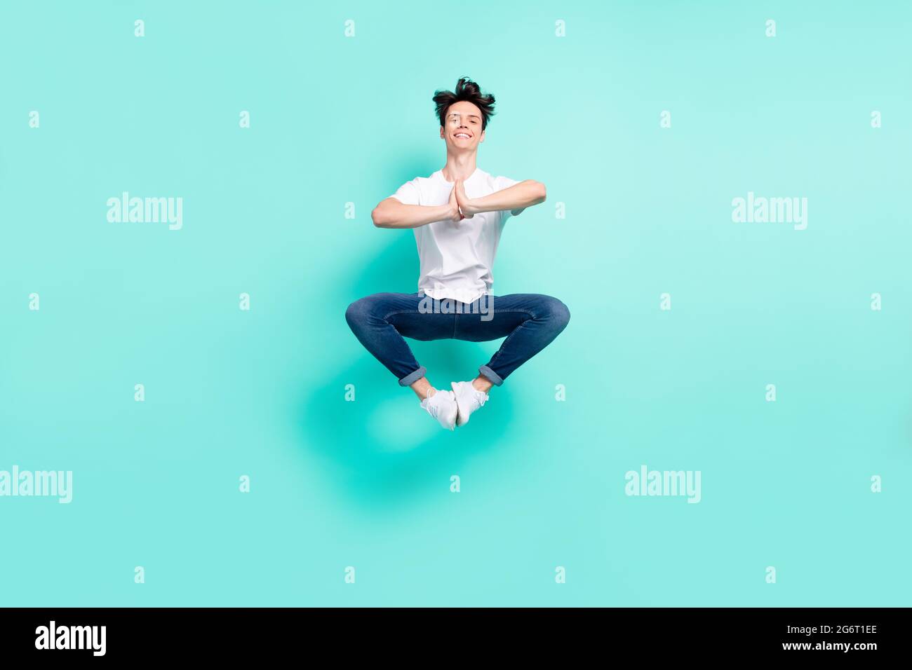 Full length body size photo guy jumping practising yoga asana isolated ...