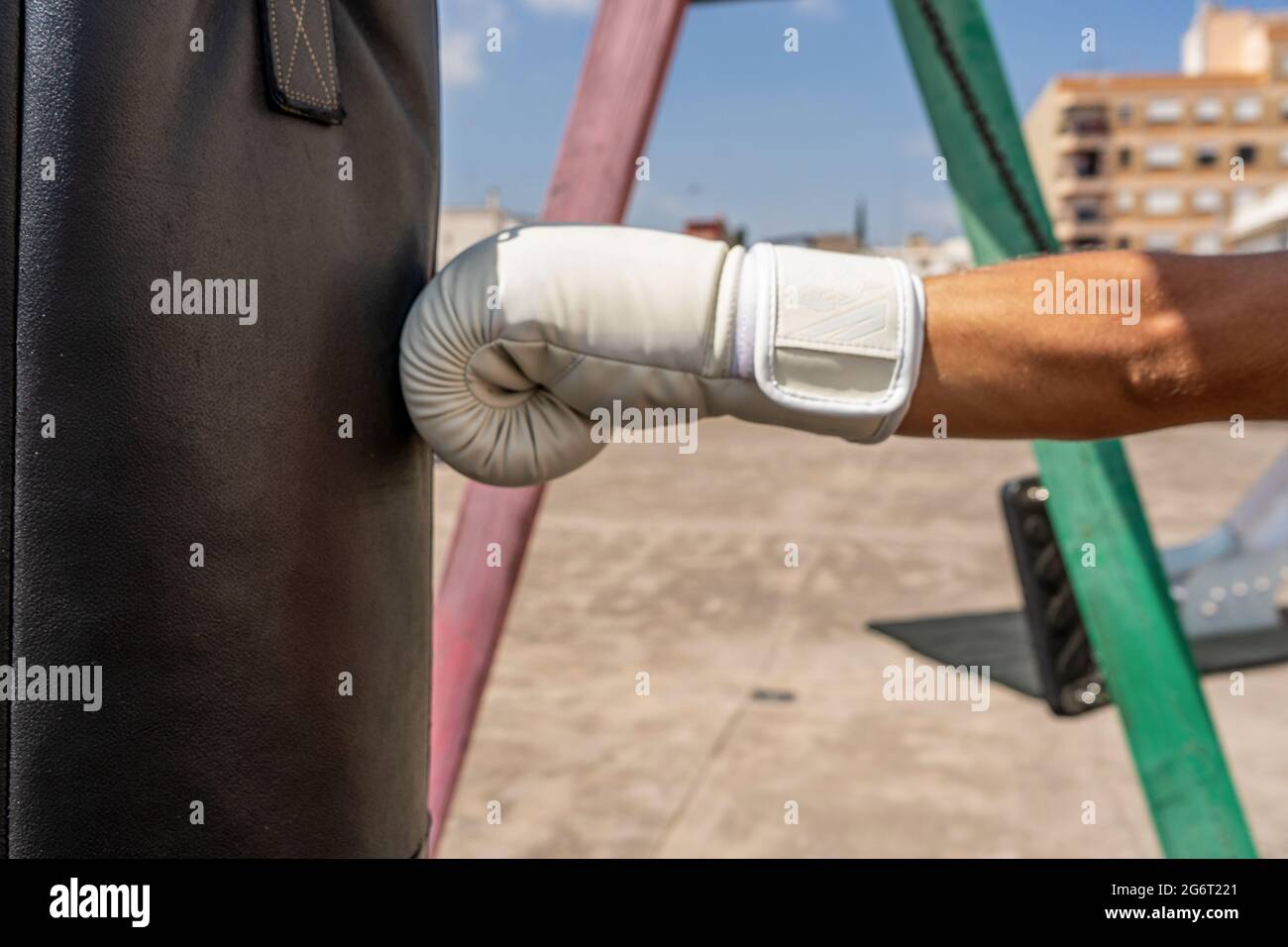 Hand of boxer and punching bag in the street. Fight concept Stock Photo ...