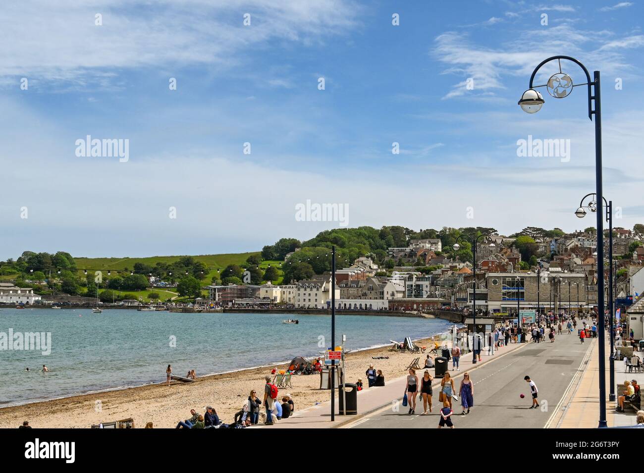 Swanage, England - June 2021: People walking along the seafront in ...