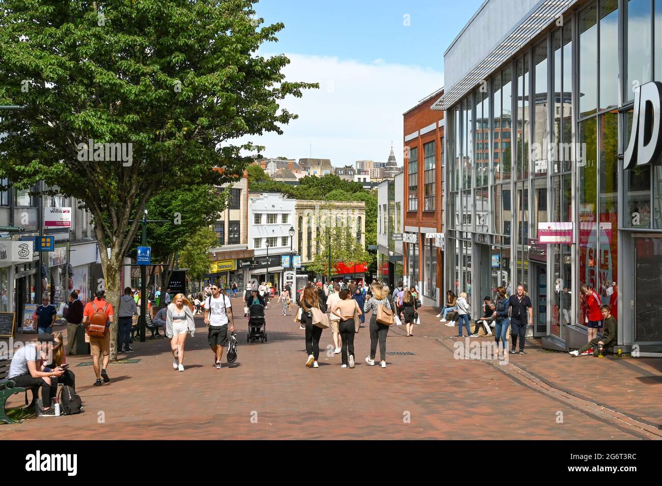 Bournemouth, England - June 2021: People walking along one of the main ...