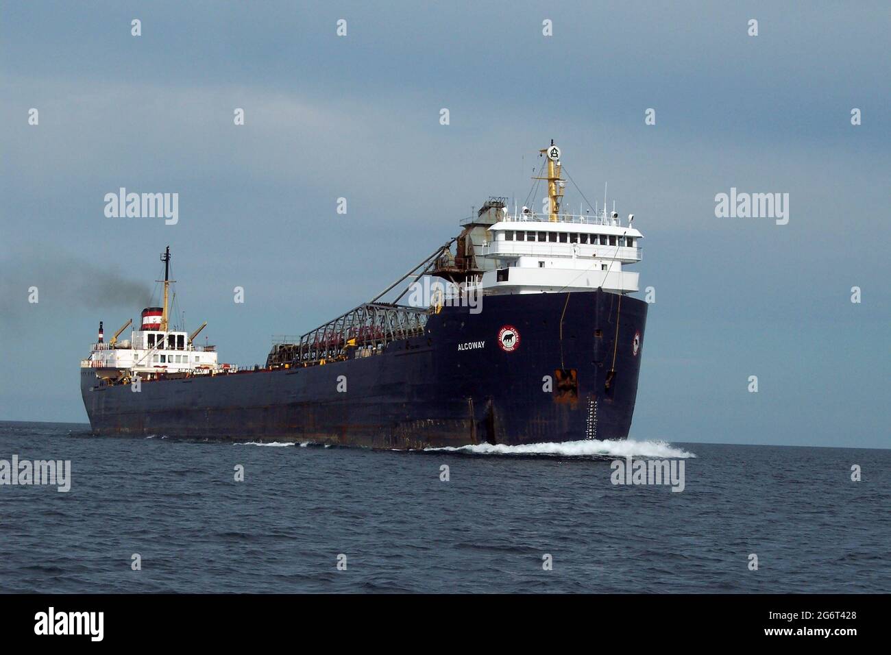 Large freighter passing through Straits of Mackinac, pass between Great ...