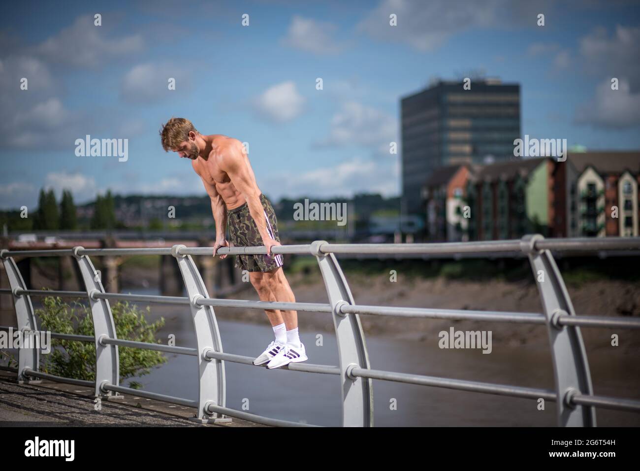 Man Doing Calisthenics Outdoors. Guy working out in the Street. Sport ...