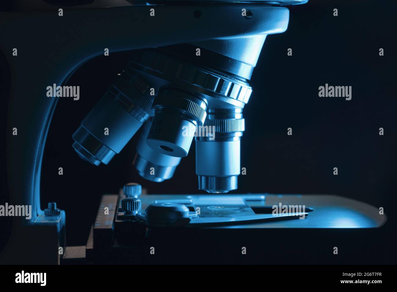 Microscope in laboratory at night. Microbiology and research concept ...
