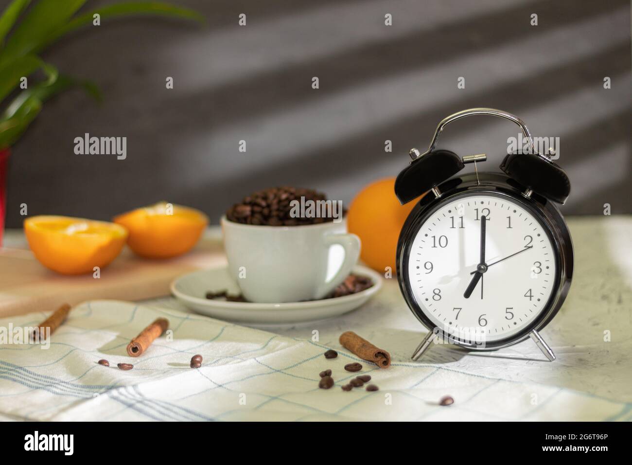 An old alarm clock points to 7.00 and the background has space for text ...
