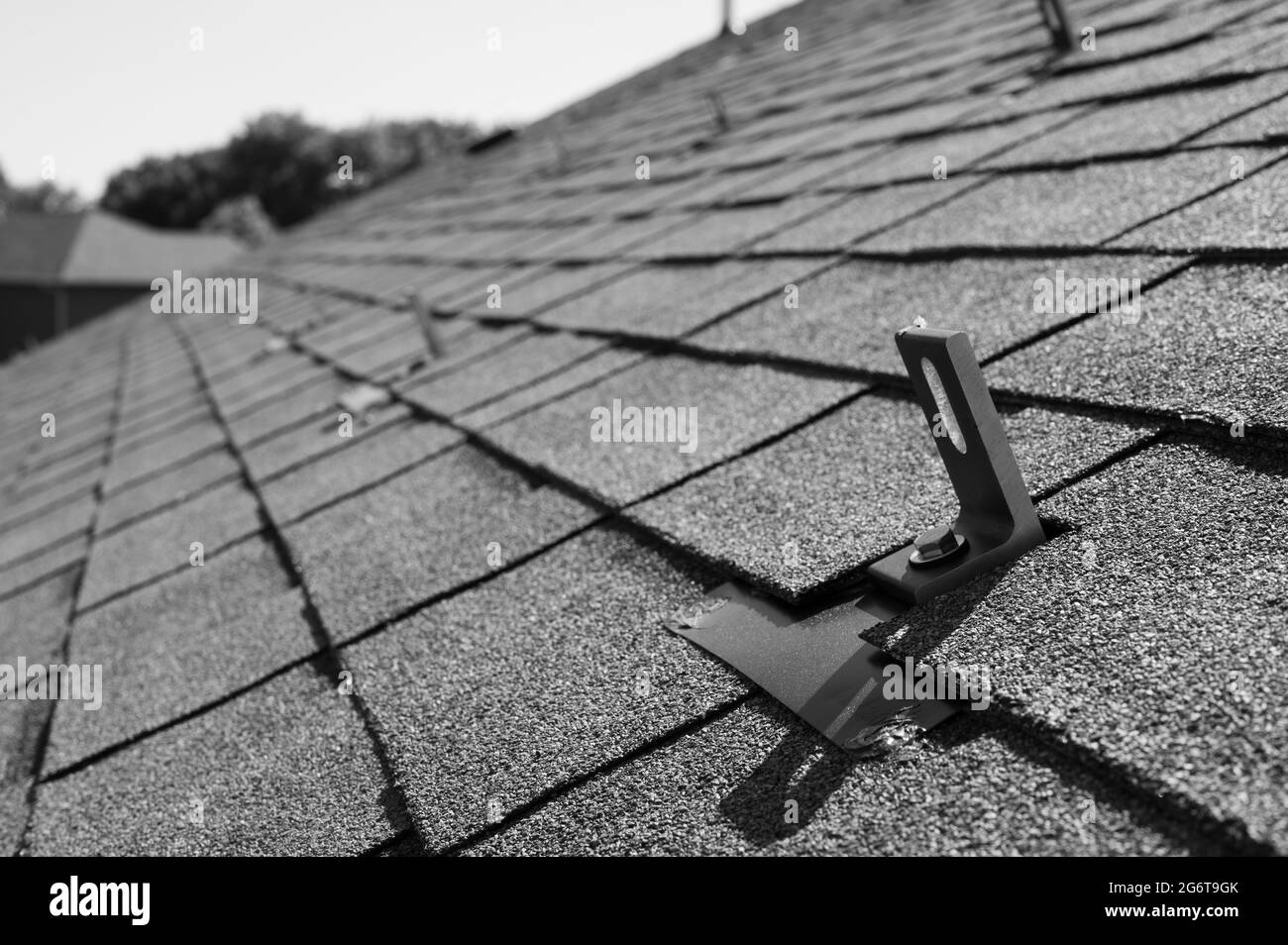 Residential asphalt shingle roof with metal anchors installed for the ...