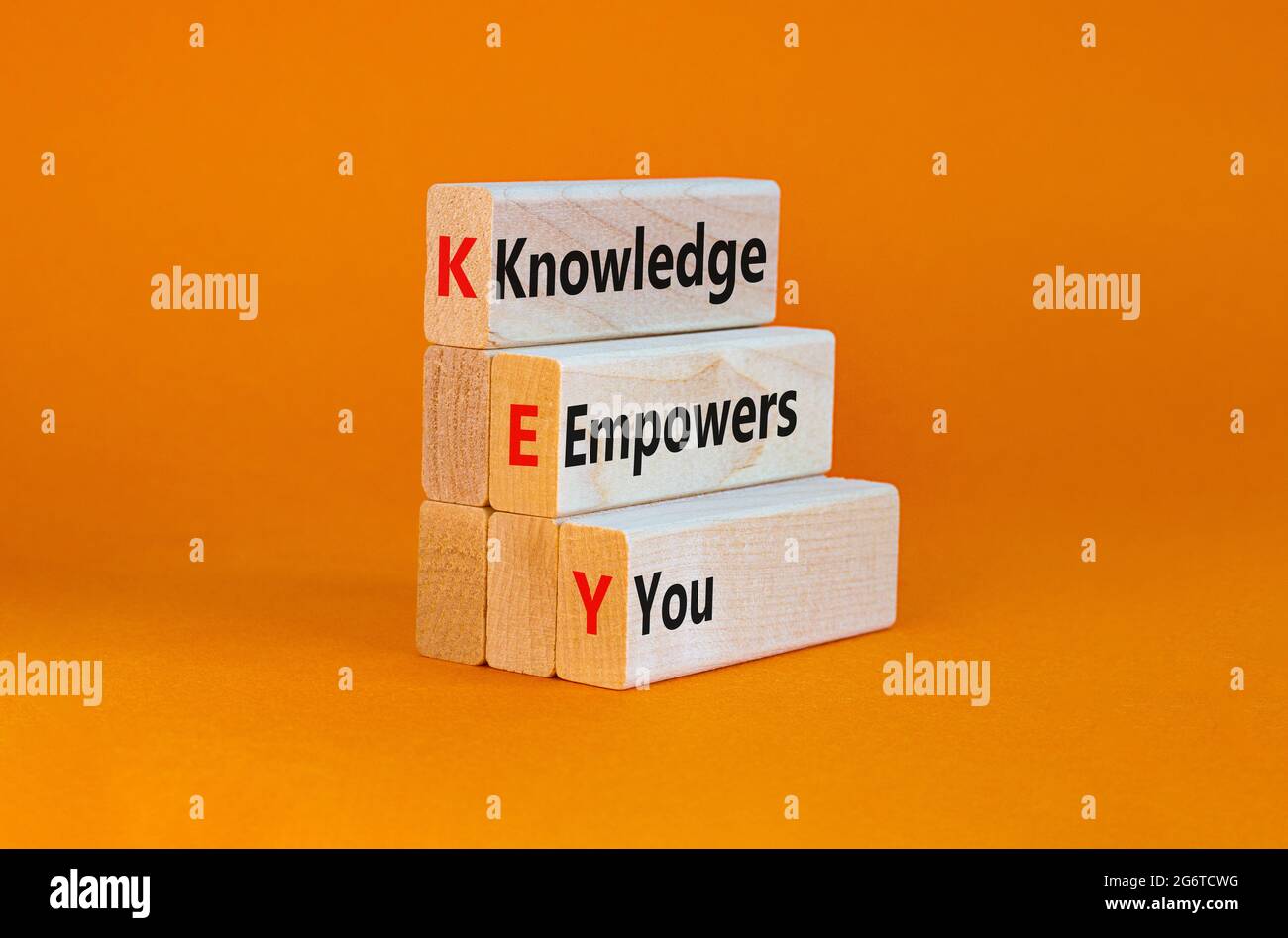 KEY, knowledge empowers you symbol. Wooden blocks with words 'KEY ...