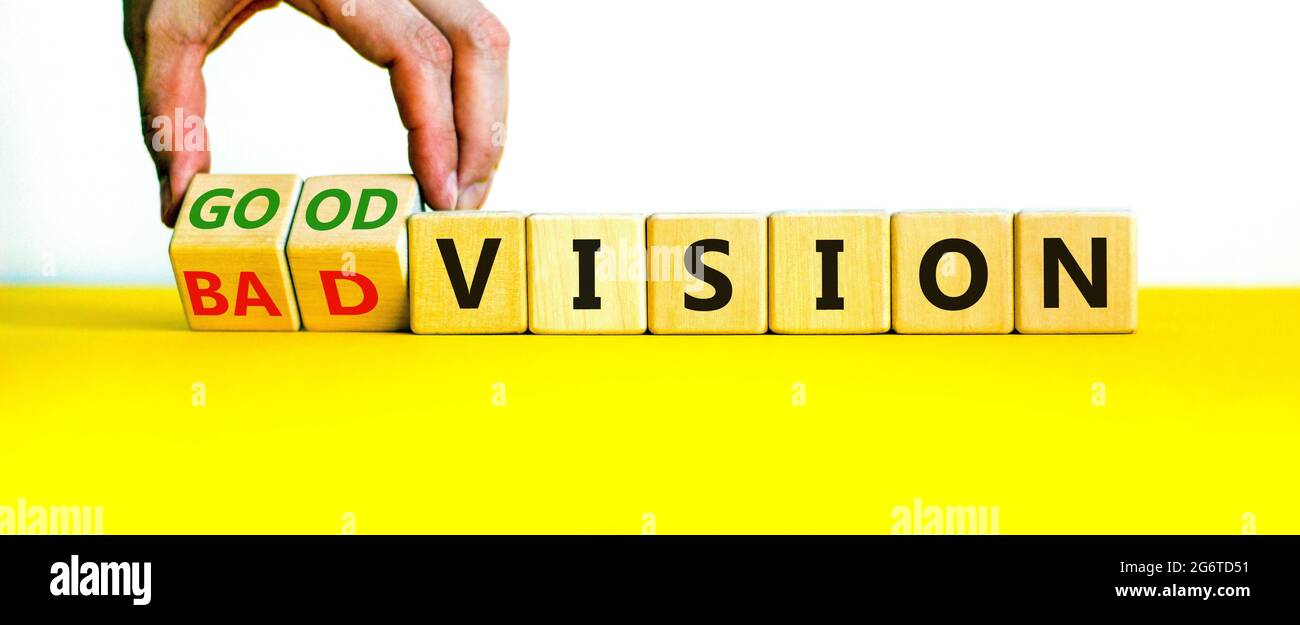 Good or bad vision symbol. Businessman turns cubes and changes words ...