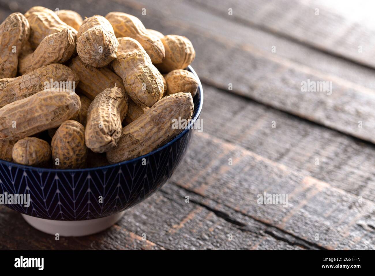 Bowl filled raw peanuts hi-res stock photography and images - Alamy