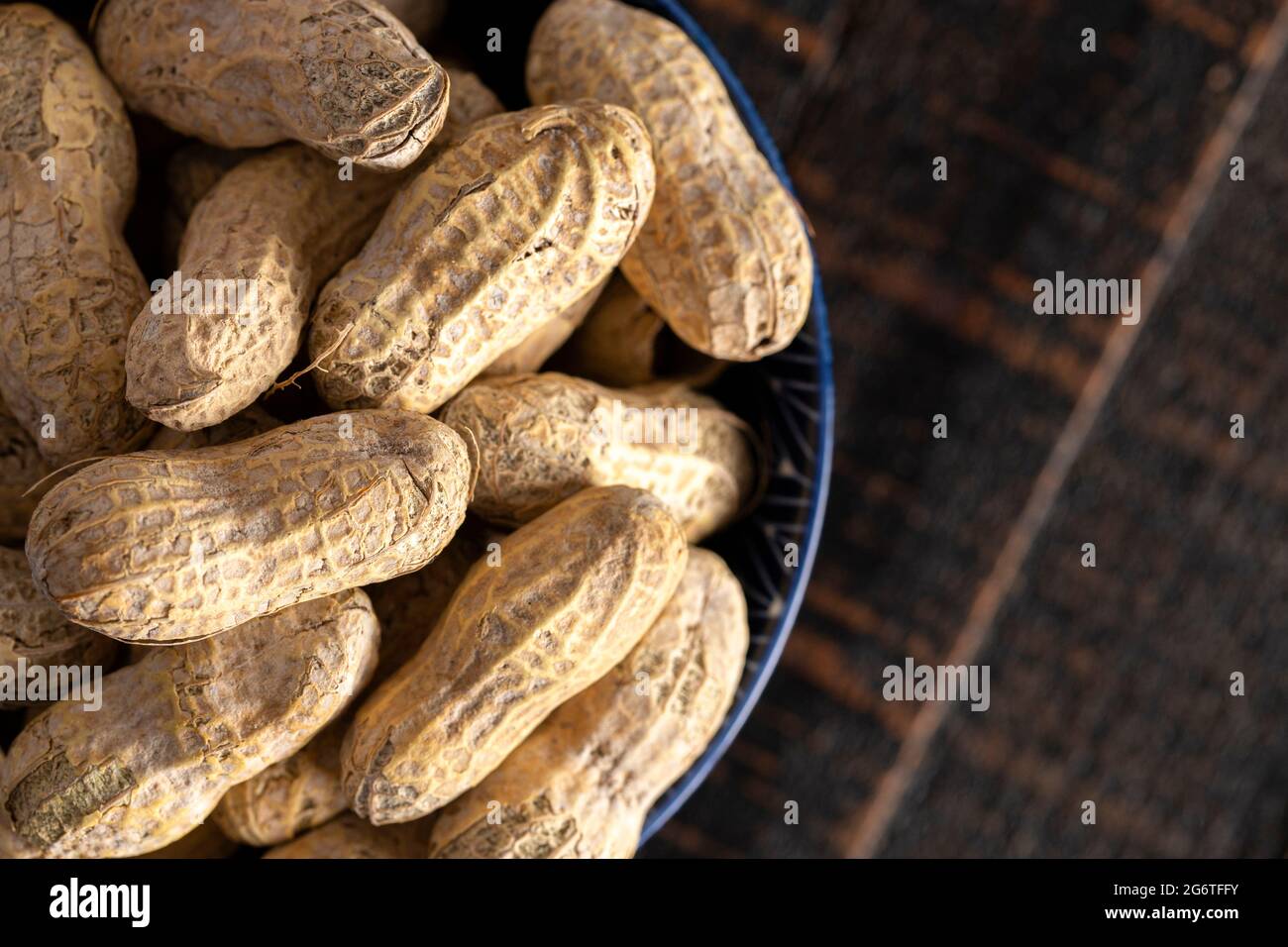Bowl filled raw peanuts hi-res stock photography and images - Alamy